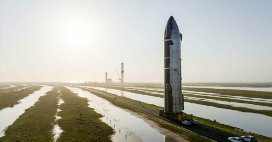 A stunning rendering shows a starship with a full NASA paint job